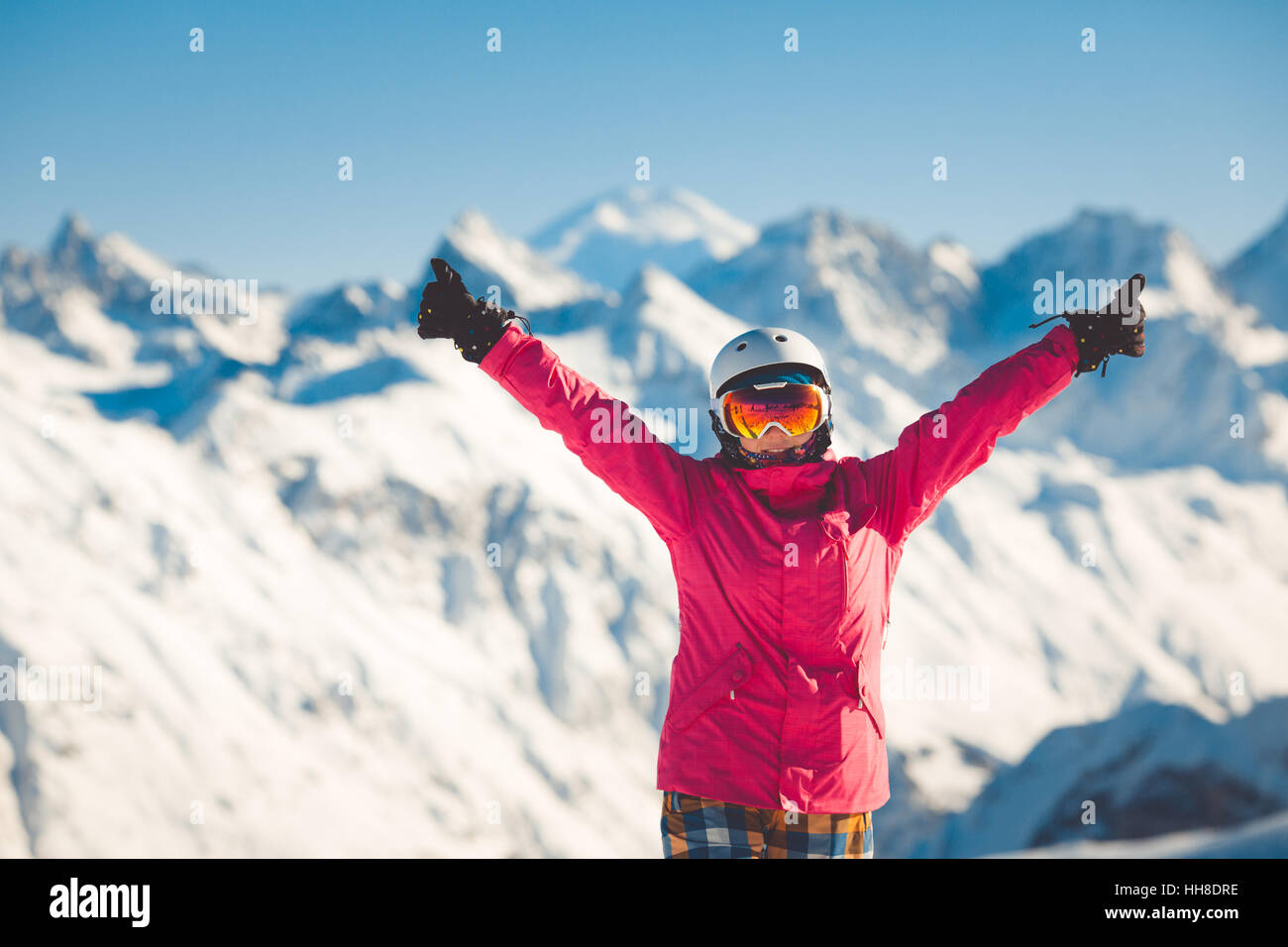 Female snowboarder in the alpine mountains Stock Photo - Alamy
