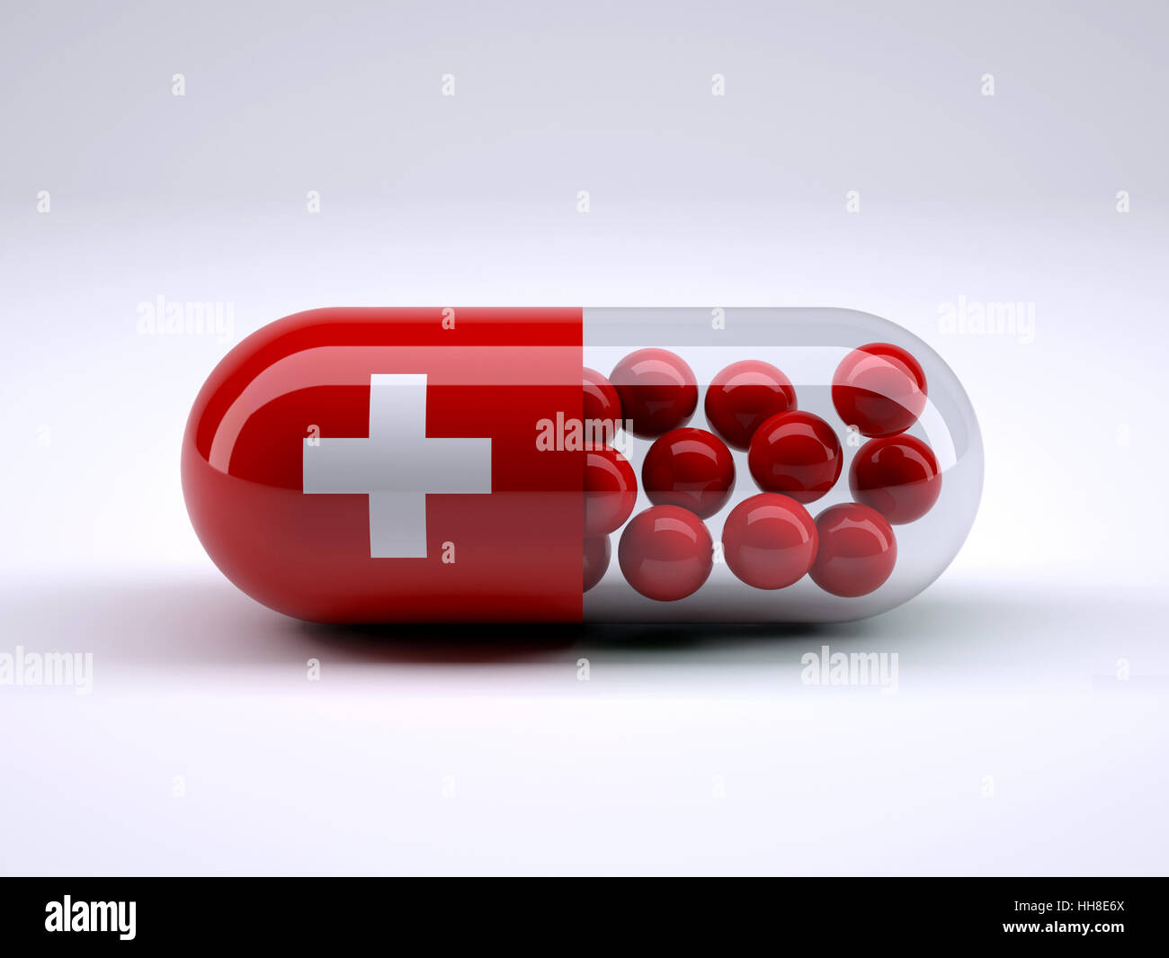 Pill with Swiss flag wrapped around it and red ball inside, 3d ...