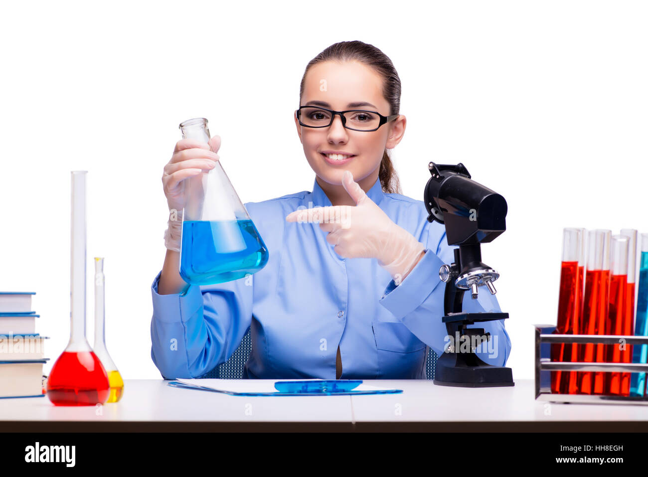 Lab chemist working with microscope and tubes Stock Photo - Alamy