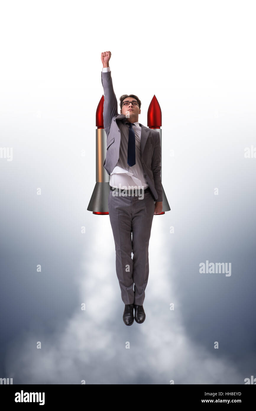 Man flying with the rocket in business concept Stock Photo - Alamy
