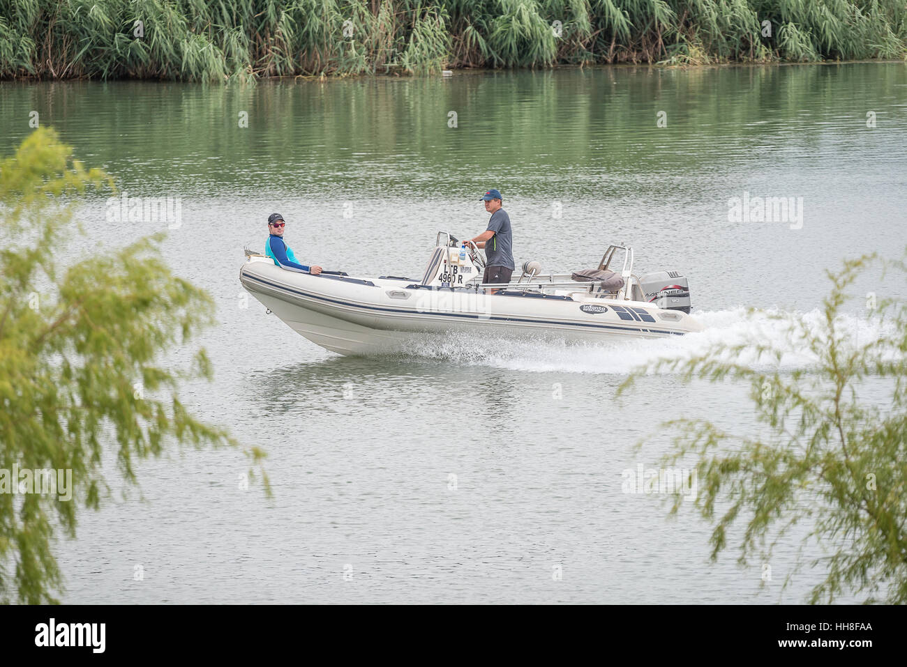 RITCHIE, SOUTH AFRICA - DECEMBER 30, 2016: Two unidentified people in a ...