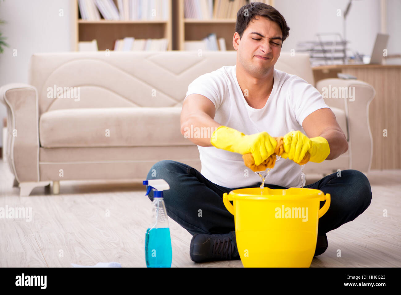 Man husband cleaning the house helping wife Stock Photo - Alamy