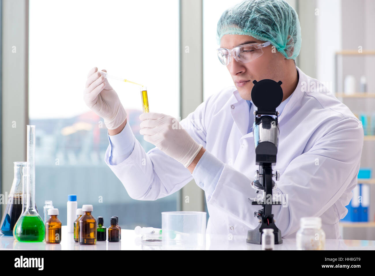 Young scientist working in the lab Stock Photo - Alamy