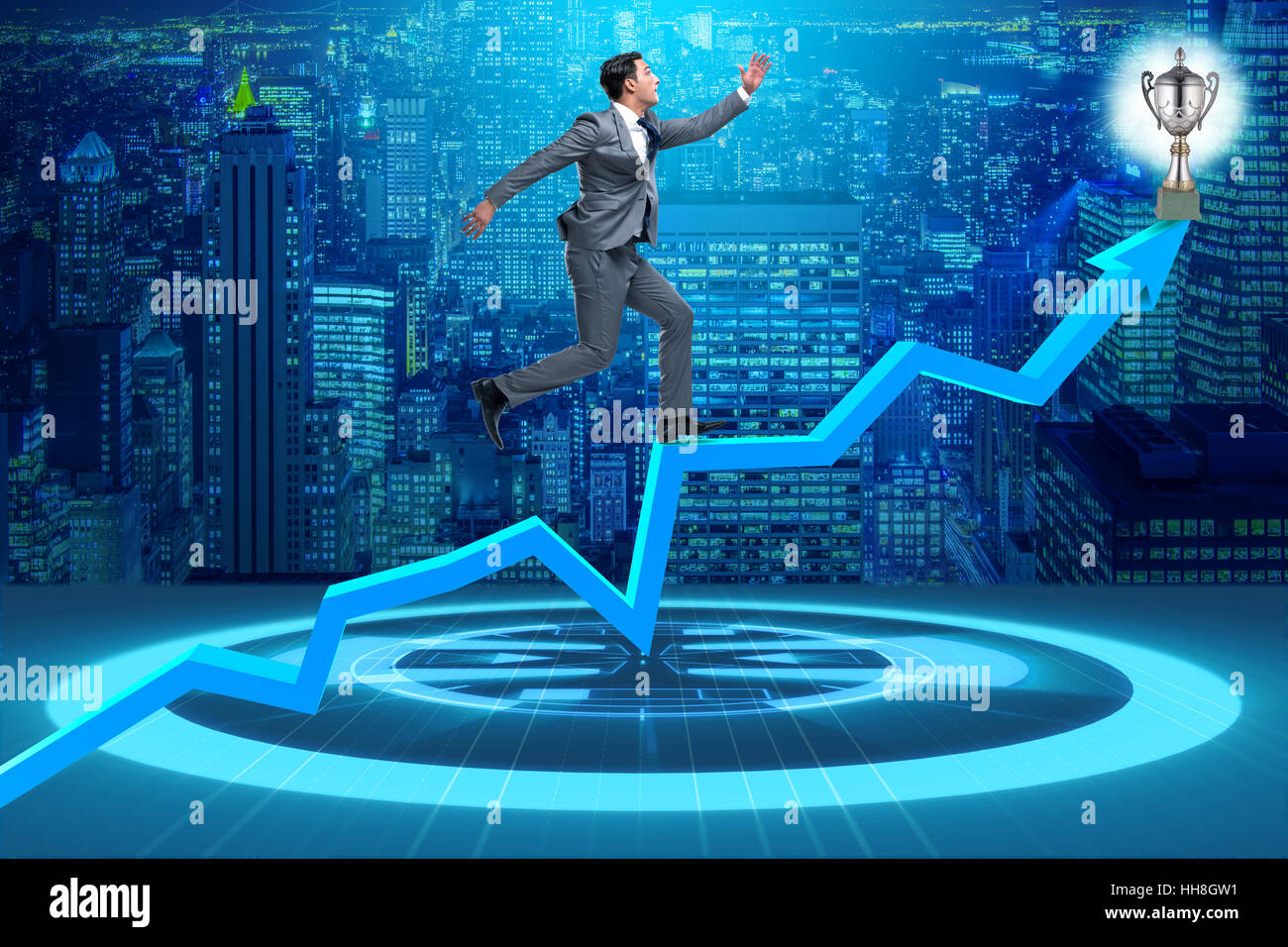 Businessman running towards prize cup trophy Stock Photo - Alamy