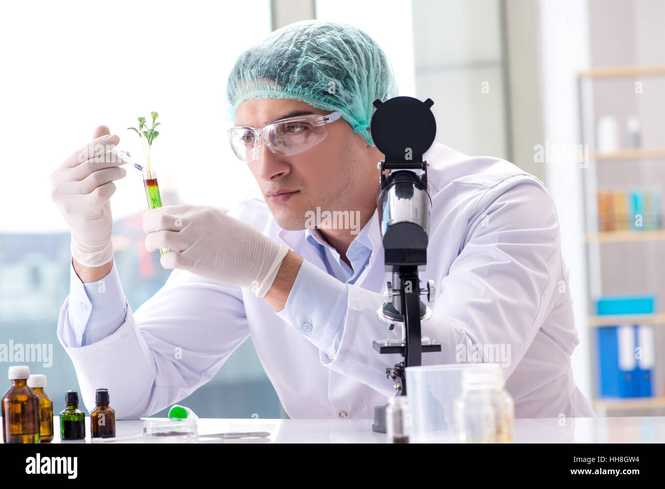 Biotechnology concept with scientist in lab Stock Photo - Alamy