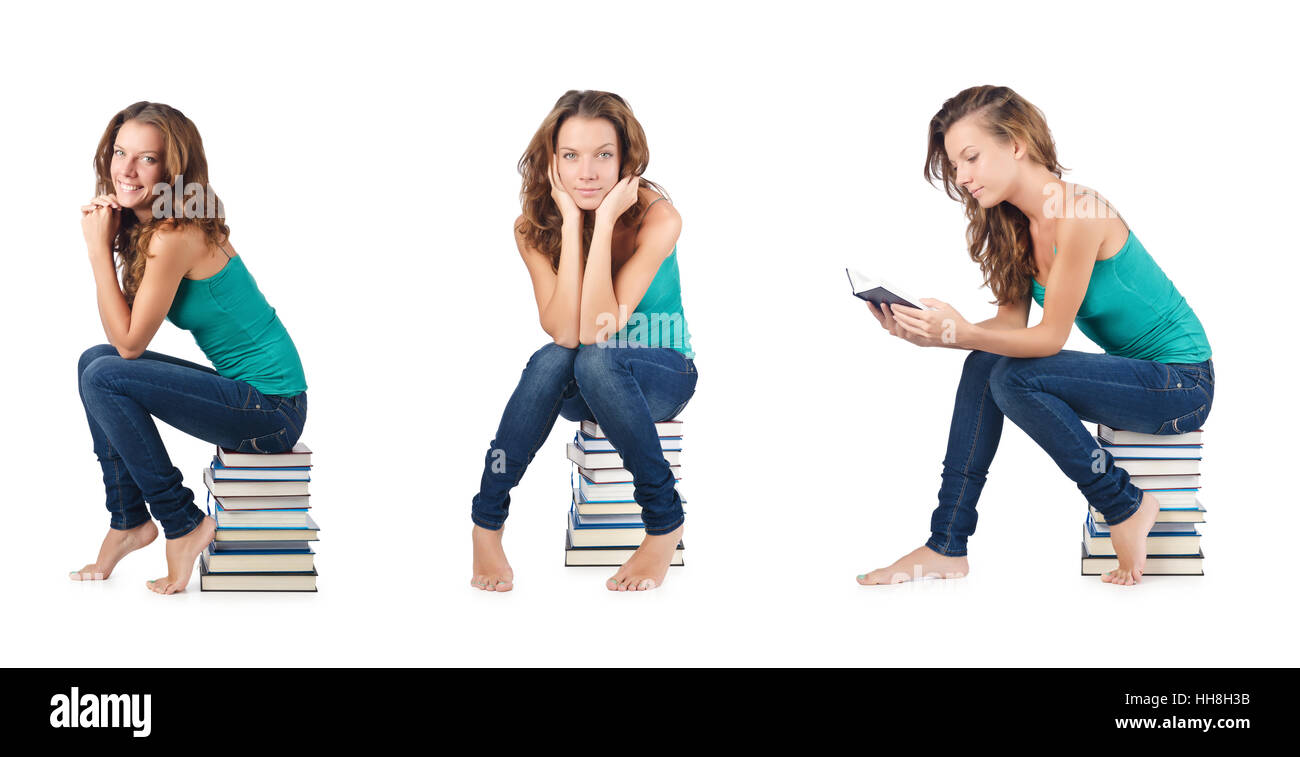 Student sitting on stack of books Stock Photo - Alamy