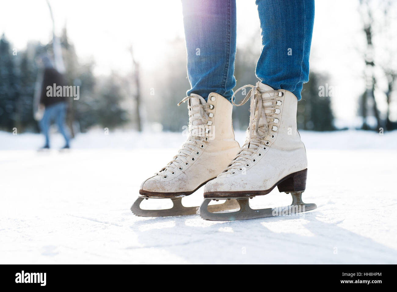 Legs of unrecognizable woman ice skating outdoors, close up Stock Photo ...