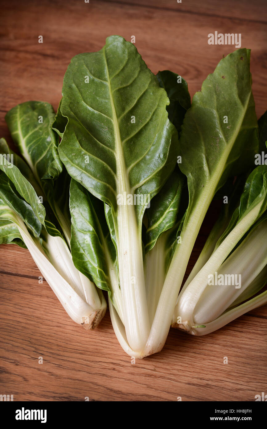 bunches of fresh chard on the wood table Stock Photo - Alamy