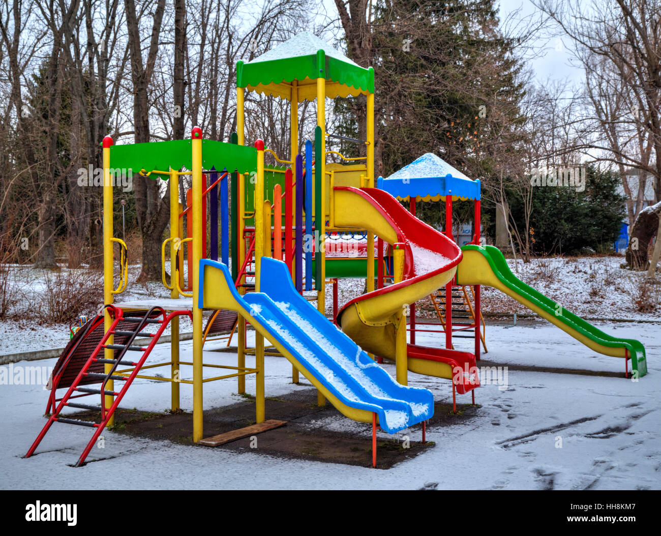 Children's playground covered with snow in winter Stock Photo - Alamy
