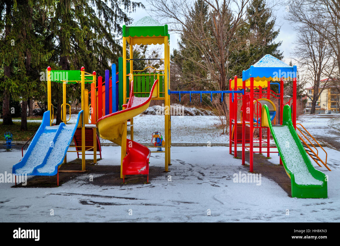 Children's playground covered with snow in winter Stock Photo - Alamy