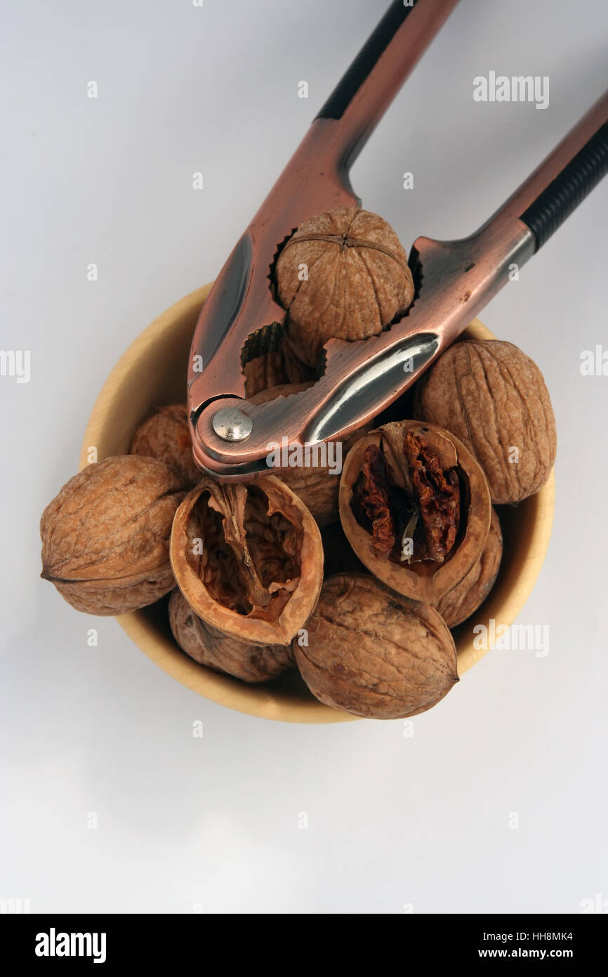 Nutcracker and walnuts. Walnuts and a nutcracker Stock Photo - Alamy
