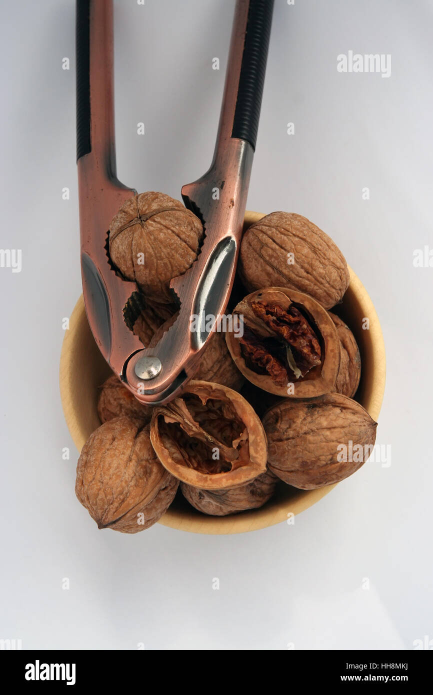 Nutcracker and walnuts. Walnuts and a nutcracker Stock Photo - Alamy