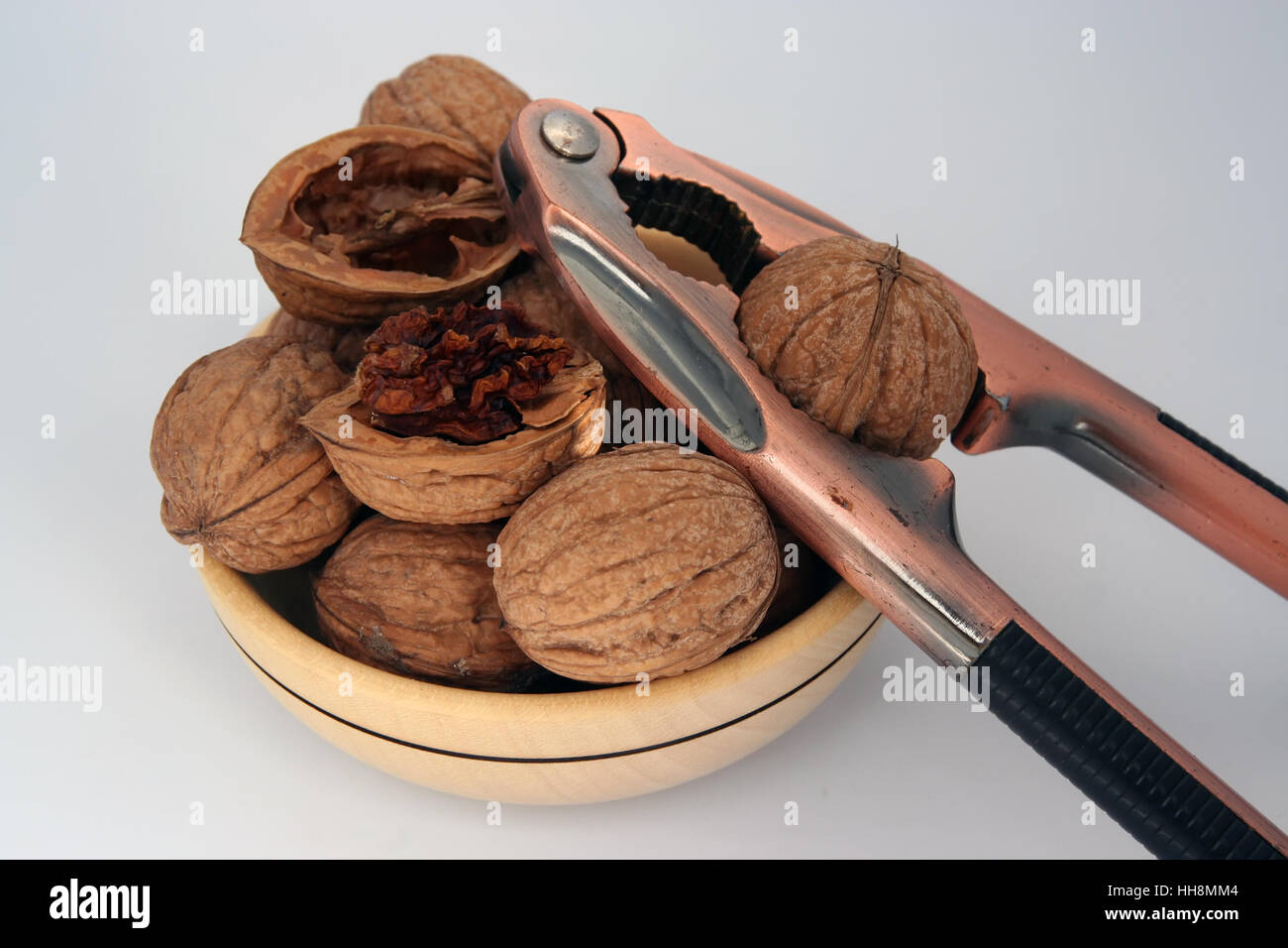 Nutcracker and walnuts. Walnuts and a nutcracker Stock Photo - Alamy