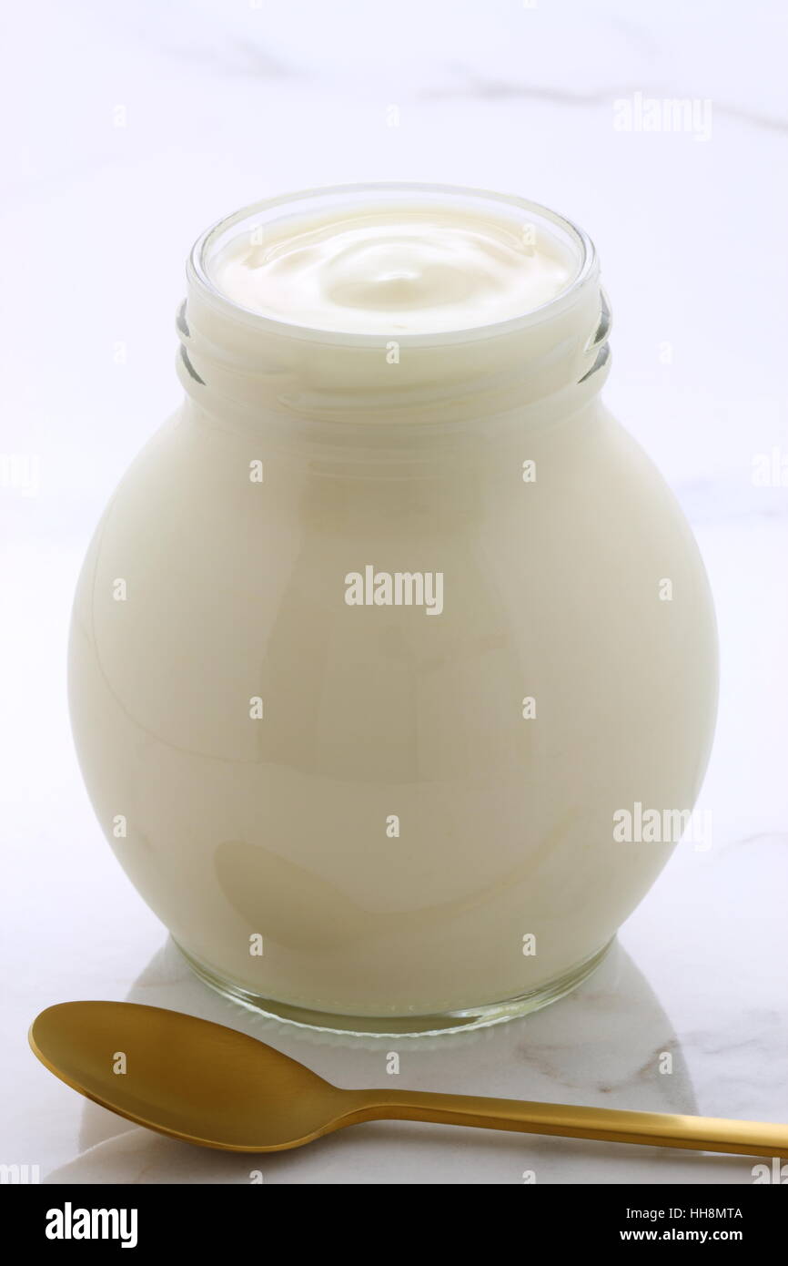 Delicious, nutritious and healthy fresh plain yogurt pot. On vintage ...