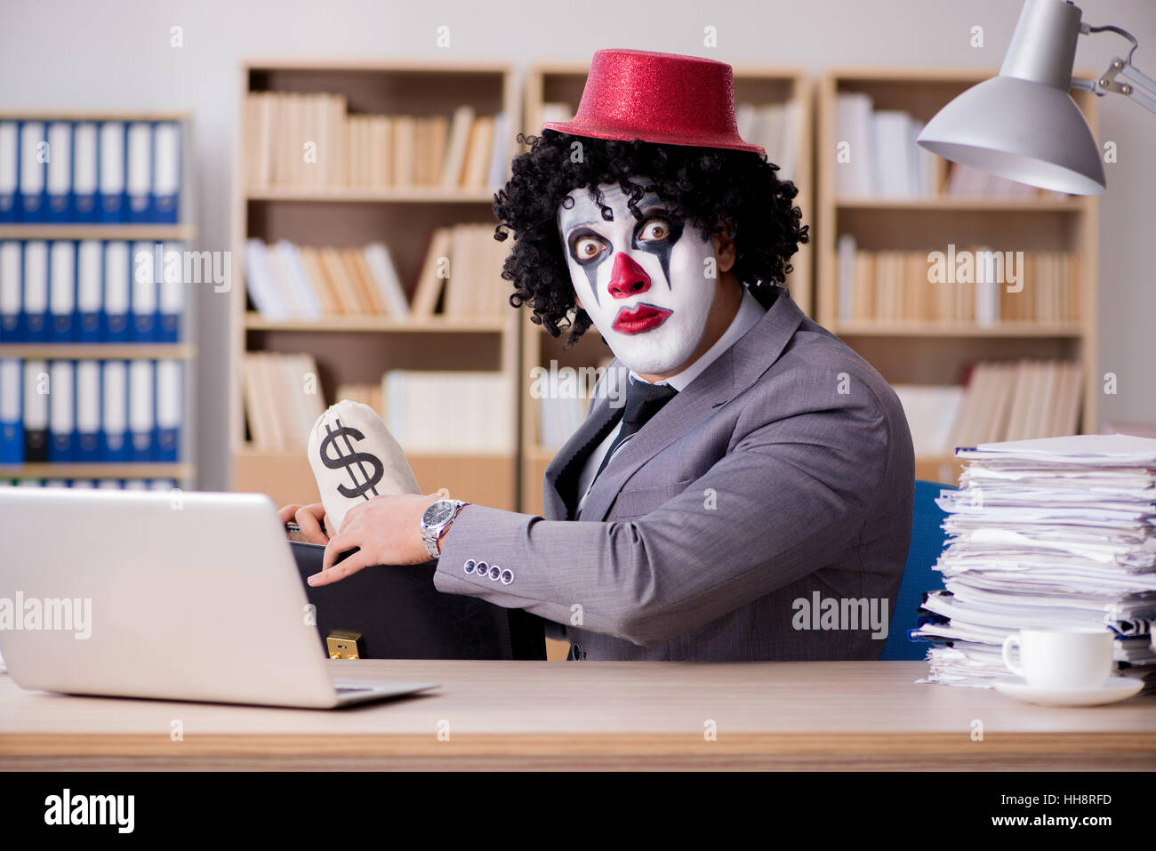 Clown businessman working in the office Stock Photo - Alamy