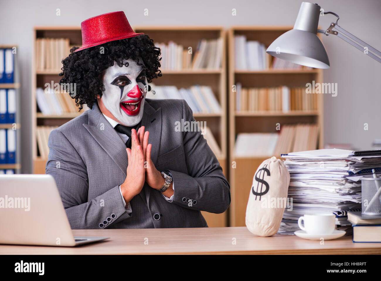 Clown businessman working in the office Stock Photo - Alamy