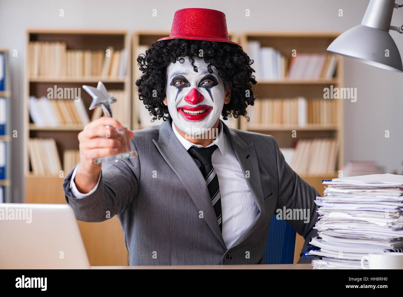 Clown businessman working in the office Stock Photo - Alamy