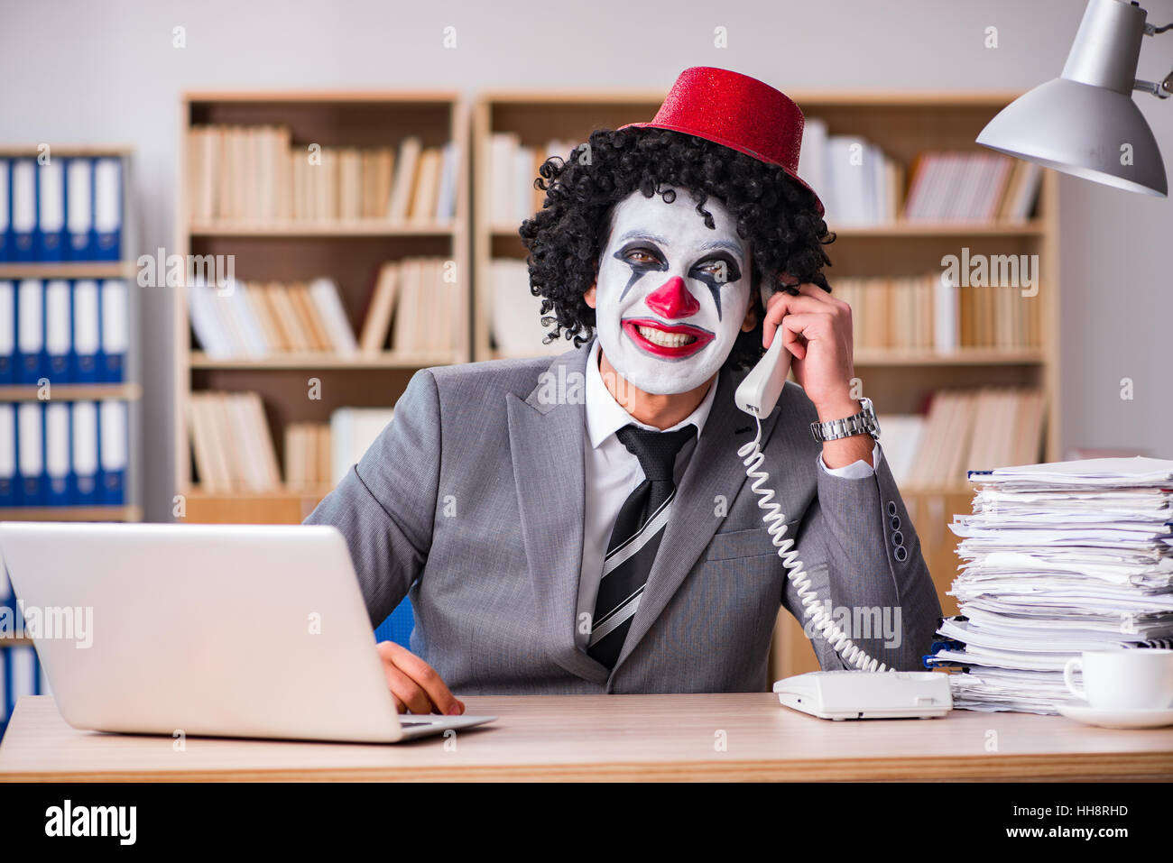 Clown businessman working in the office Stock Photo - Alamy