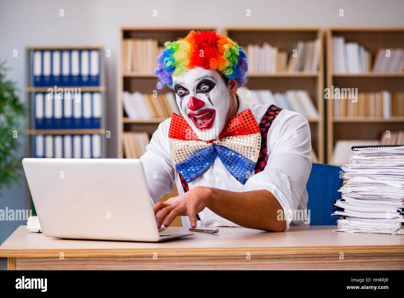 Clown businessman working in the office Stock Photo - Alamy
