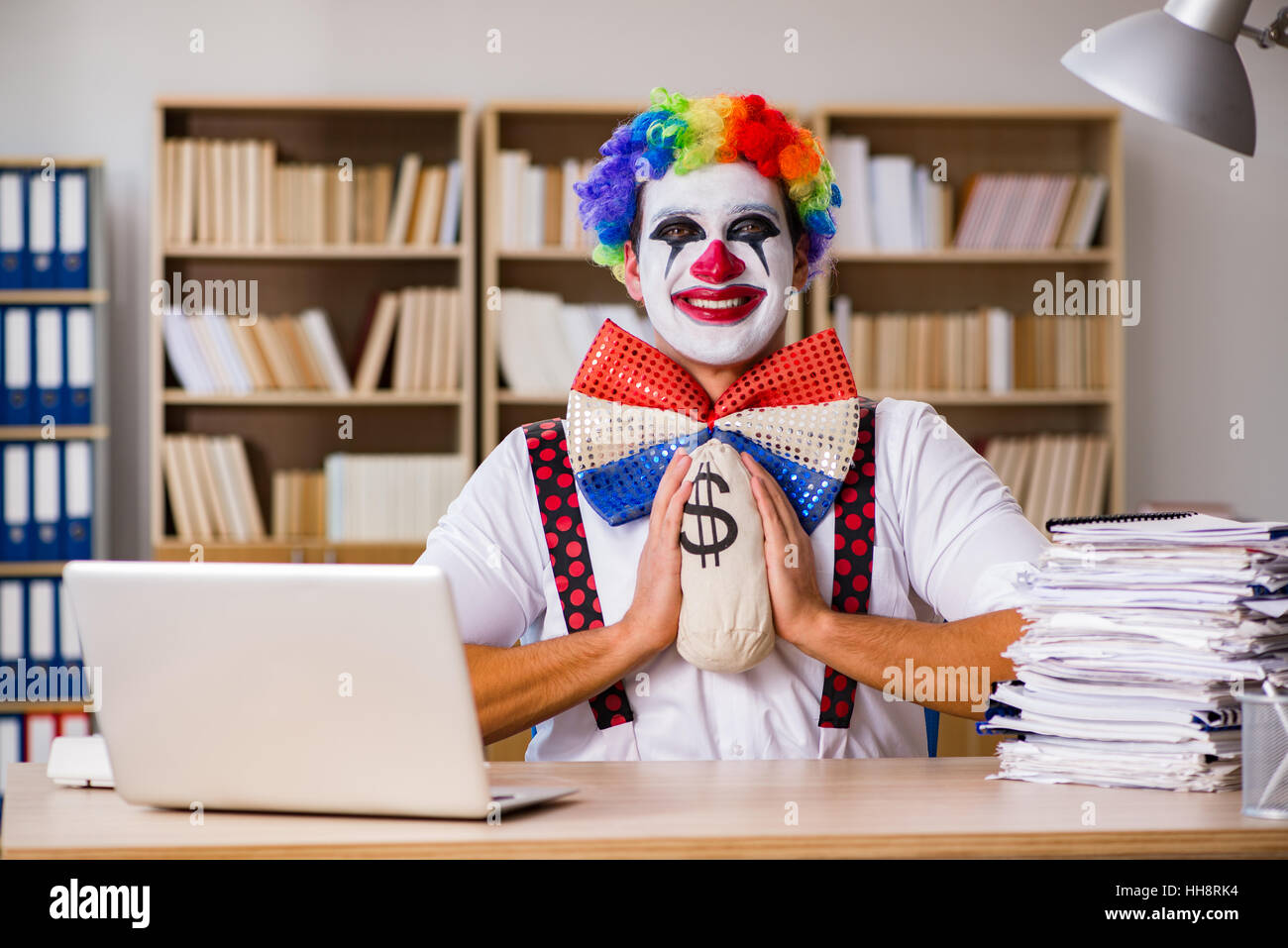 Clown businessman working in the office Stock Photo - Alamy