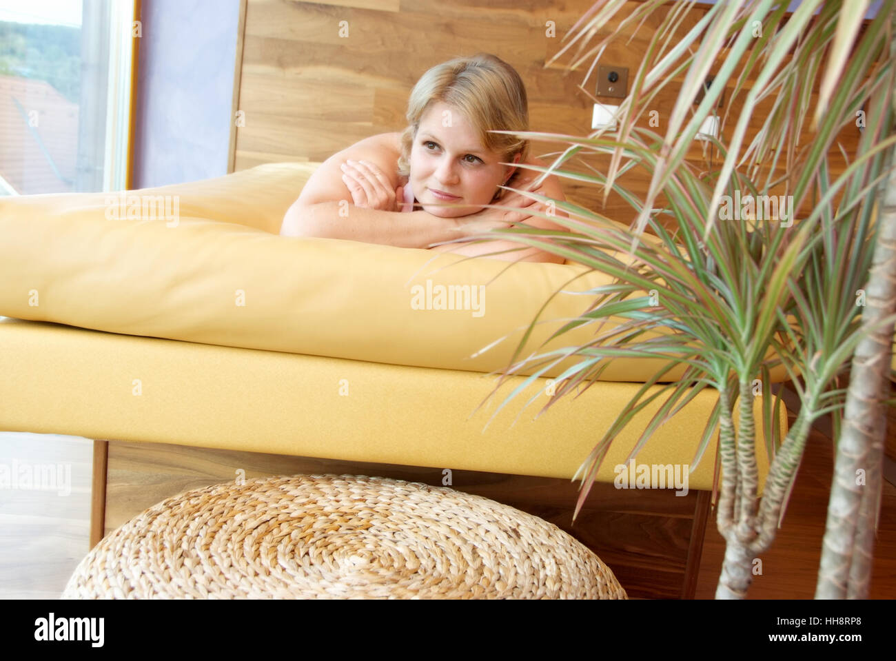 Young woman relaxing on a waterbed Stock Photo - Alamy