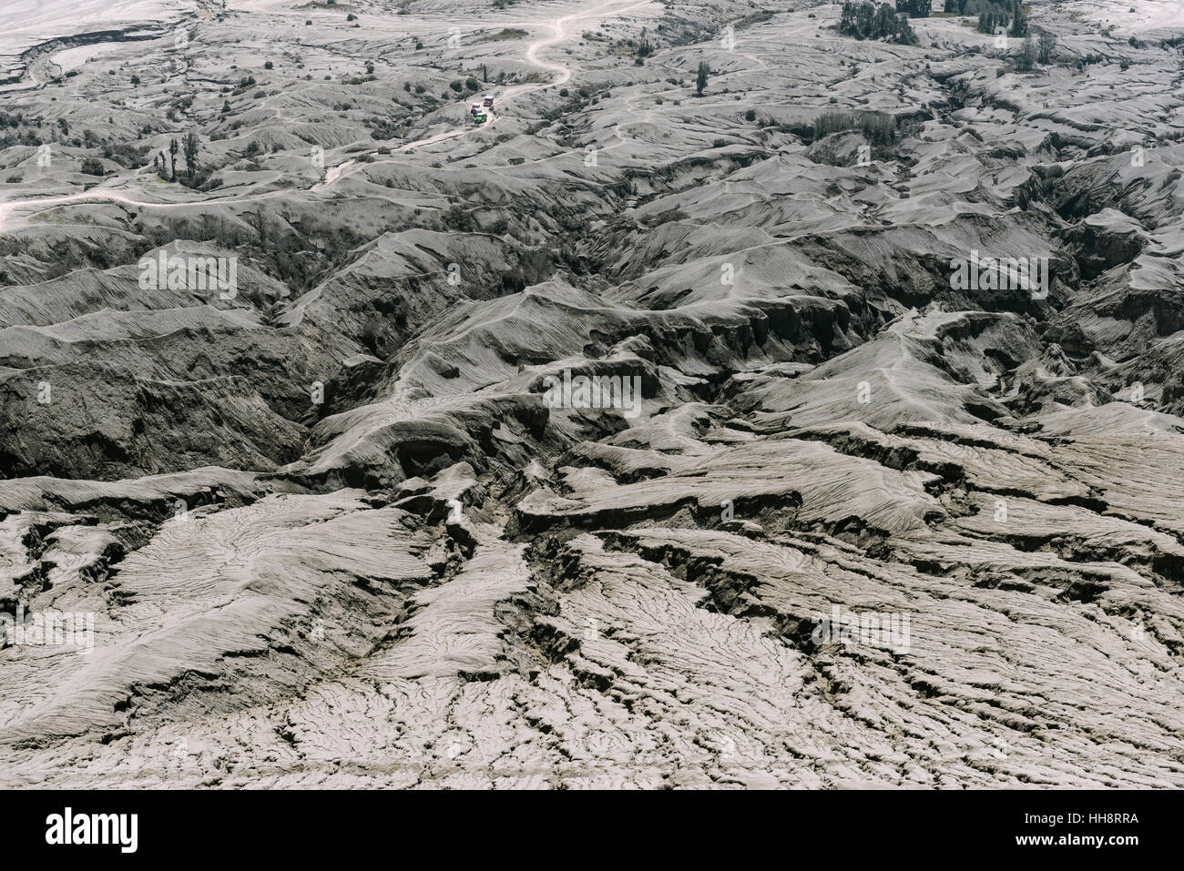 Hostile volcanic landscape, gaps and cracks, dry ground on volcano ...