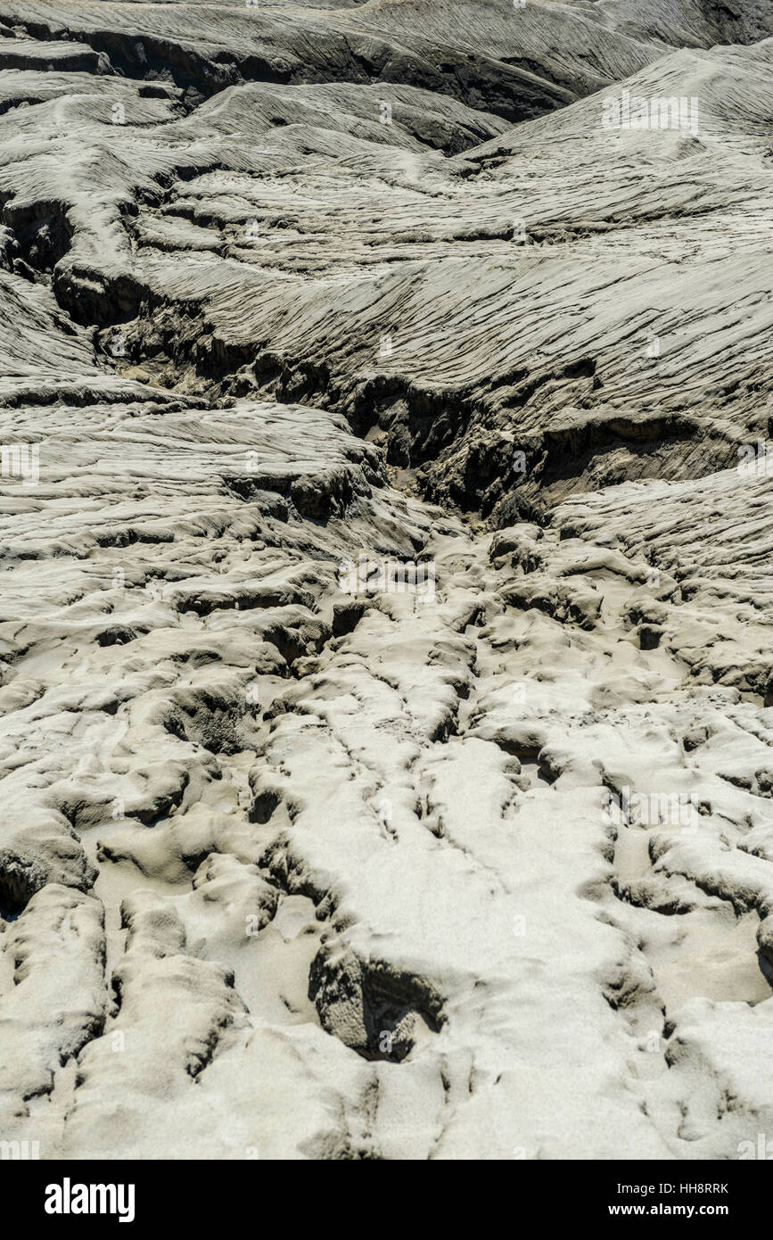 Hostile volcanic landscape, gaps and cracks, dry ground on volcano ...