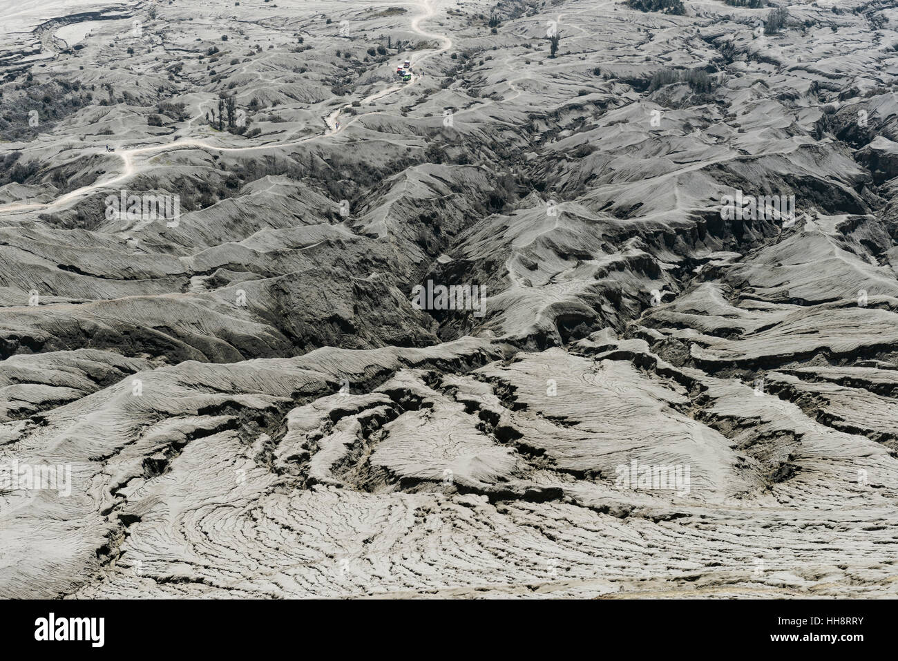 Hostile volcanic landscape, gaps and cracks, dry ground on volcano ...
