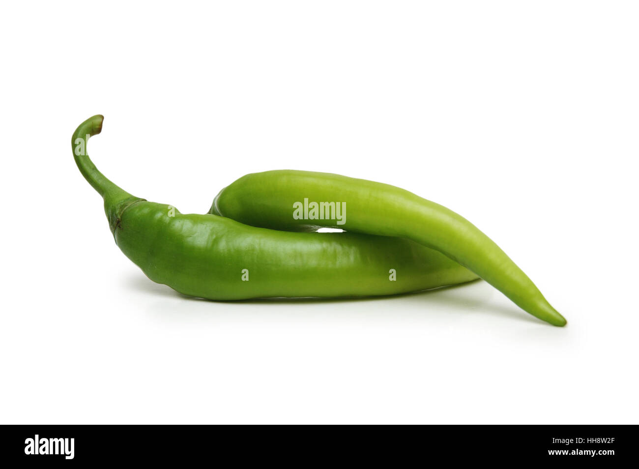 Two green chillies isolated on the white background Stock Photo - Alamy