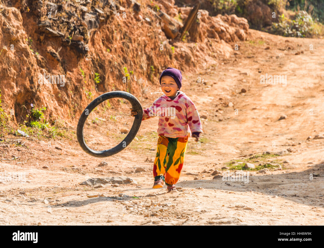 Boy with tire hi-res stock photography and images - Alamy