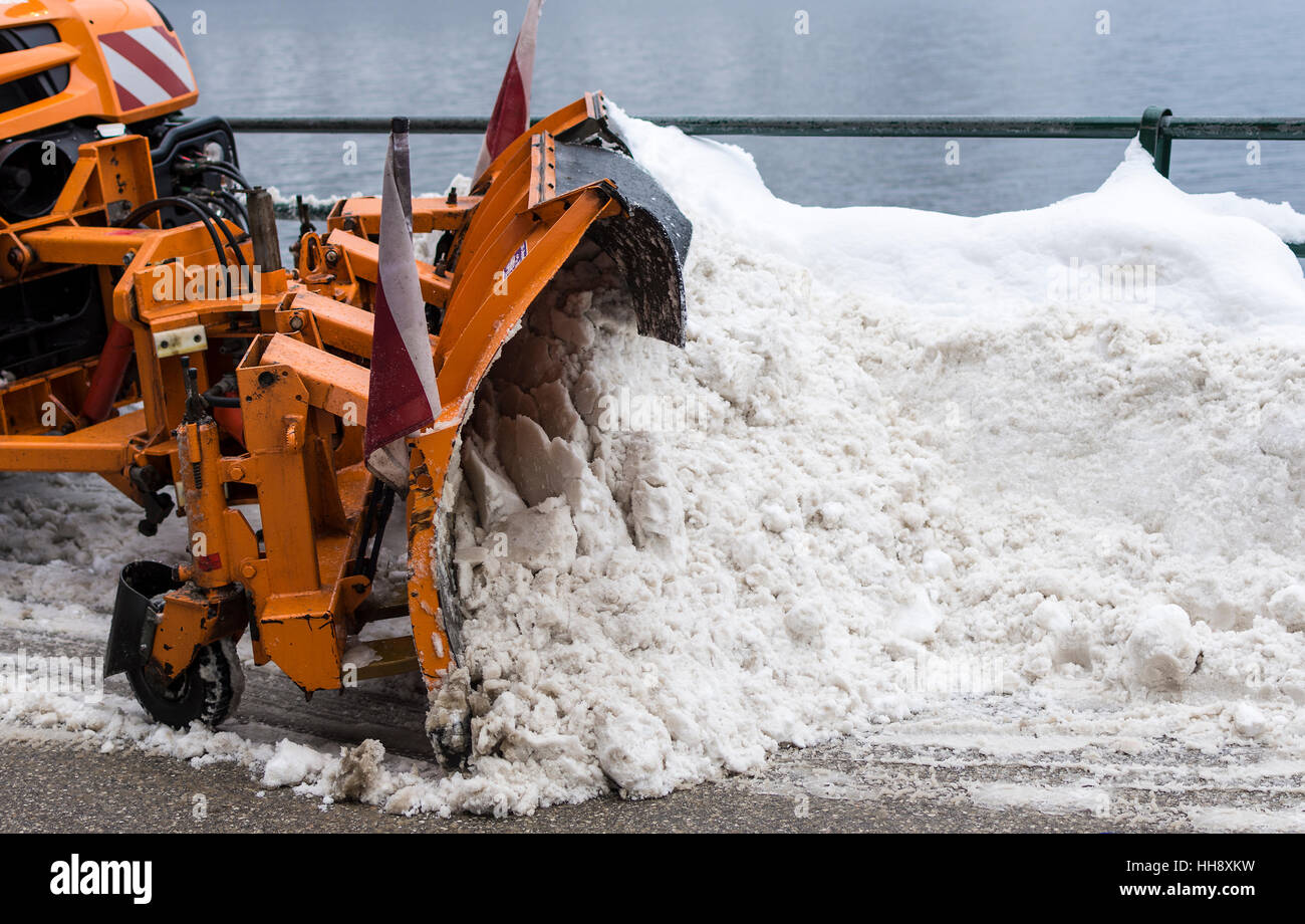Truck With Snowplough Cleaning Road by Removing Snow from Road After ...