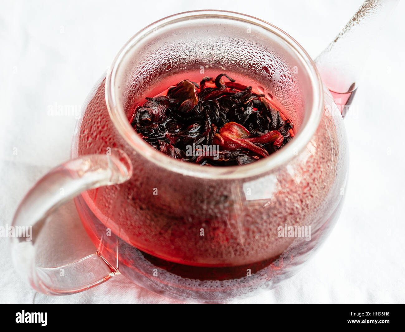 Hibiscus tea in a teapot Stock Photo - Alamy