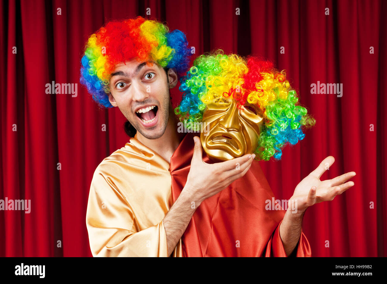 Actor with maks in a funny theater concept Stock Photo - Alamy