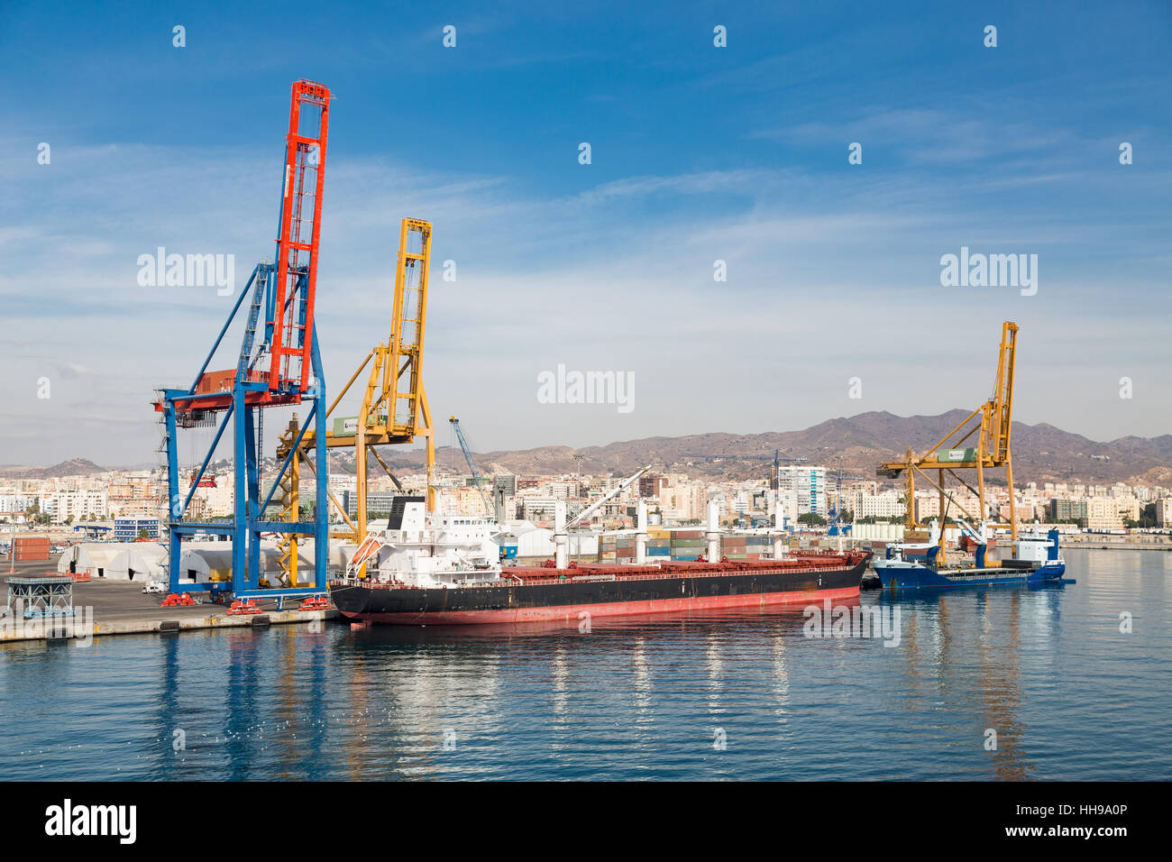 Massive freighter at an industrial dock in Malaga Spain Stock Photo - Alamy