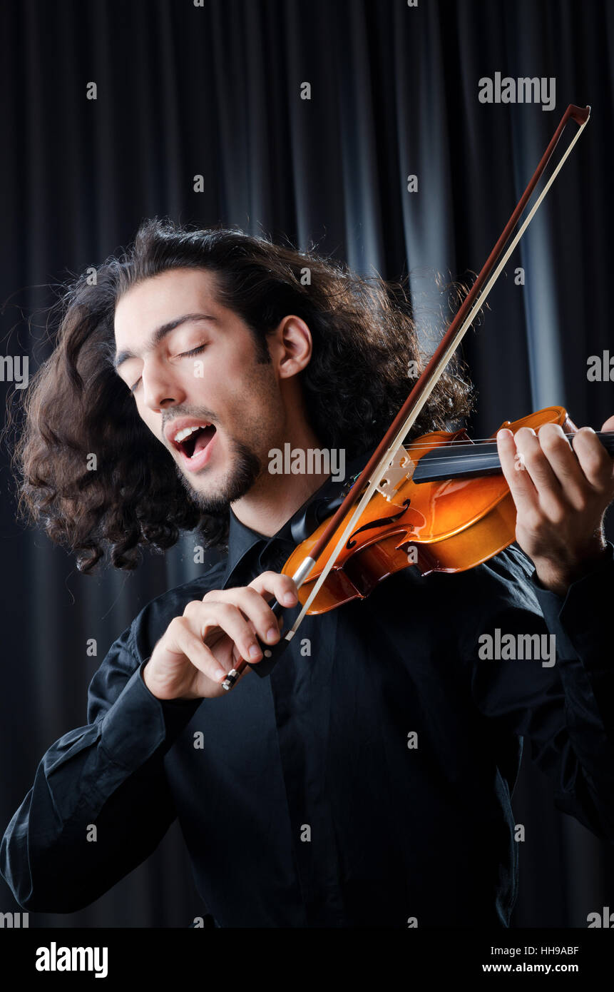 Violin player playing the intstrument Stock Photo - Alamy