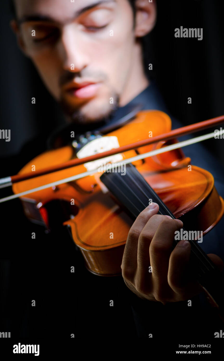 Violin player playing the intstrument Stock Photo - Alamy