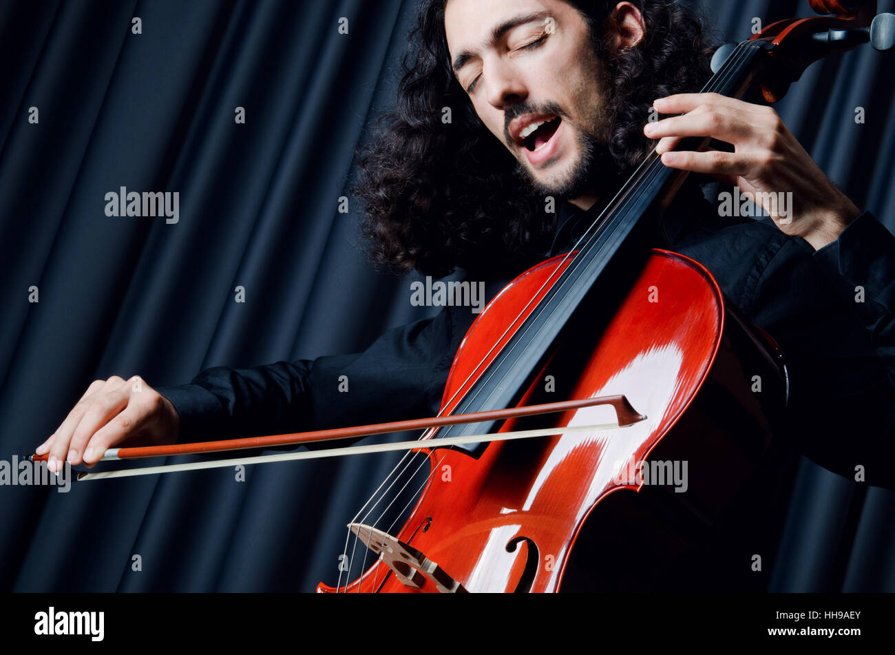 Cello player during performance Stock Photo - Alamy