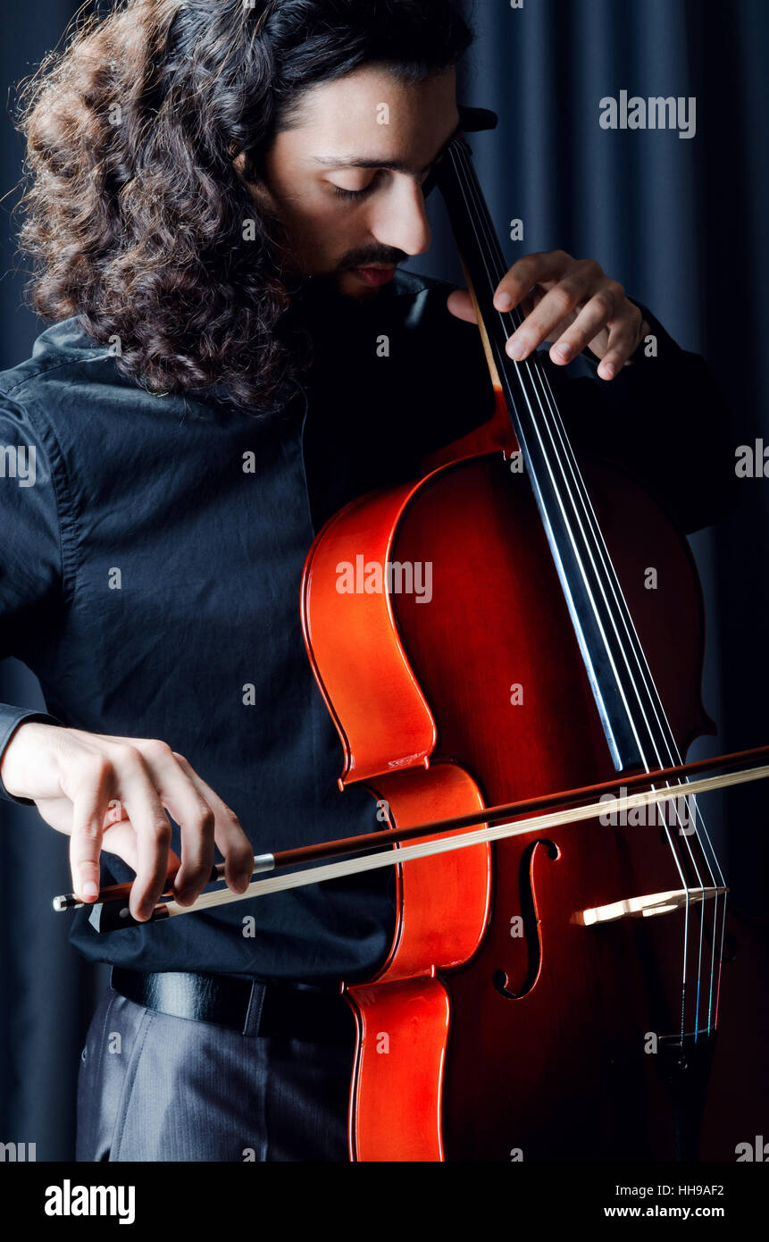 Cello player during performance Stock Photo - Alamy