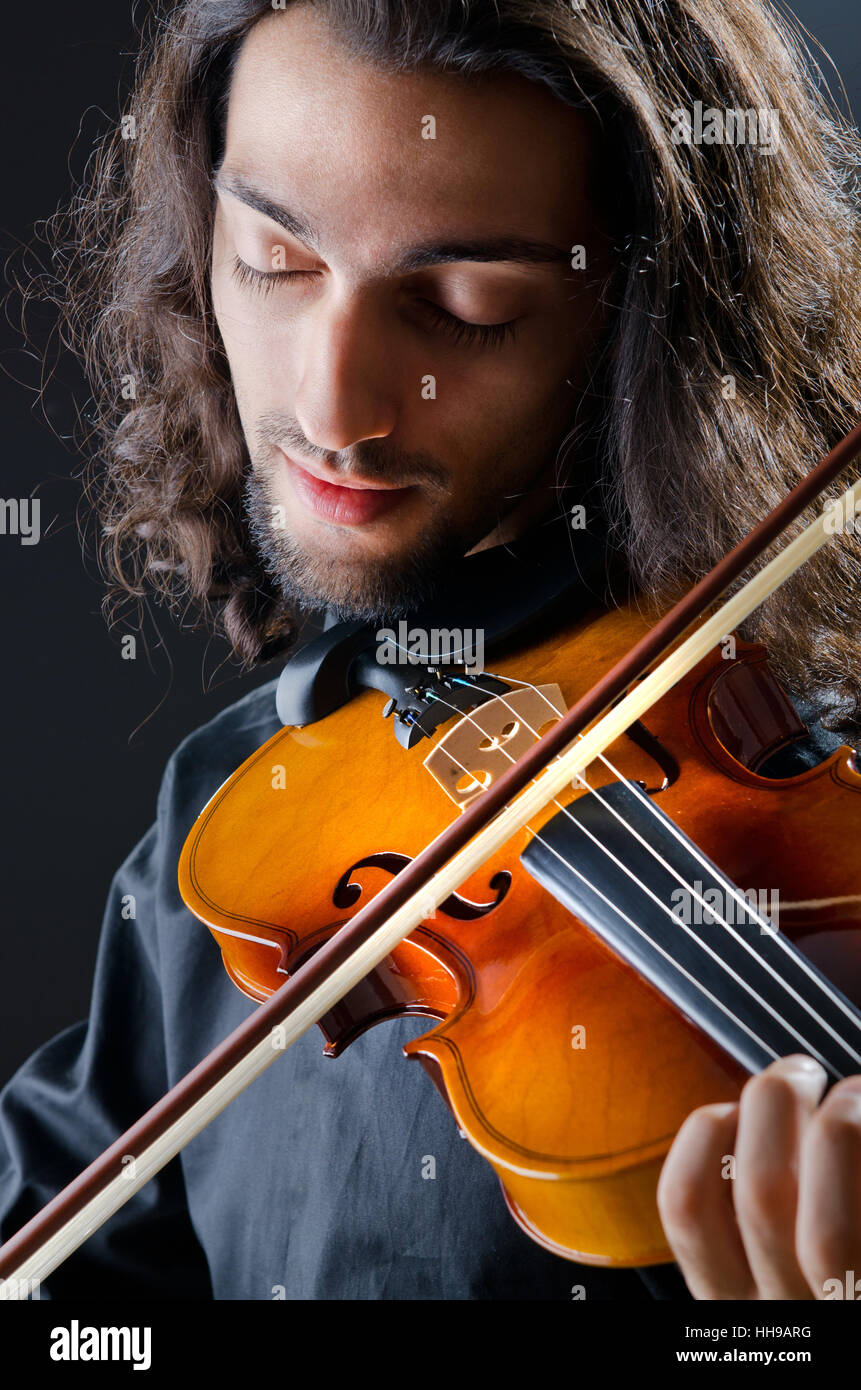 Violin player playing the intstrument Stock Photo - Alamy