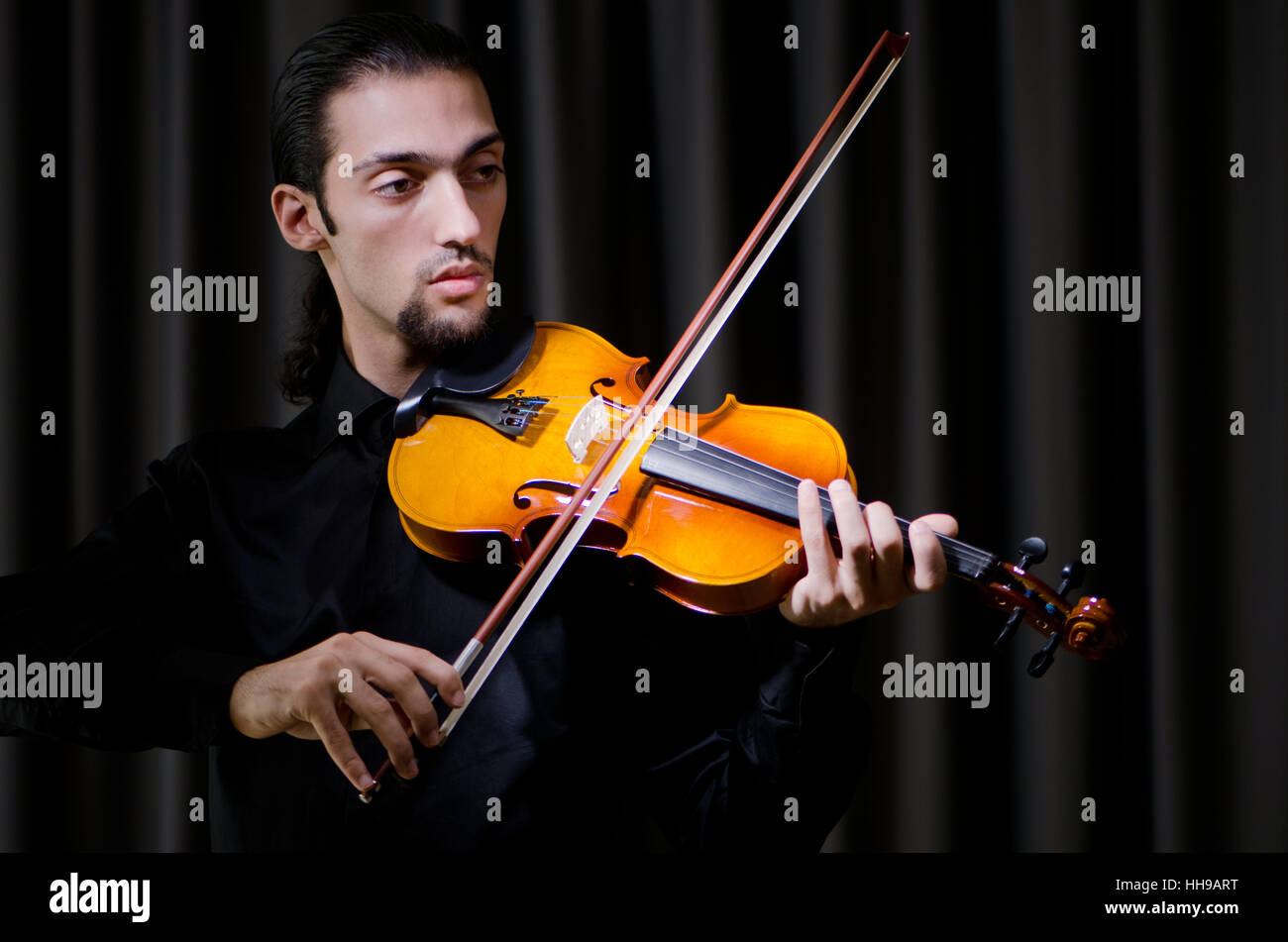 Young violin player playing Stock Photo - Alamy