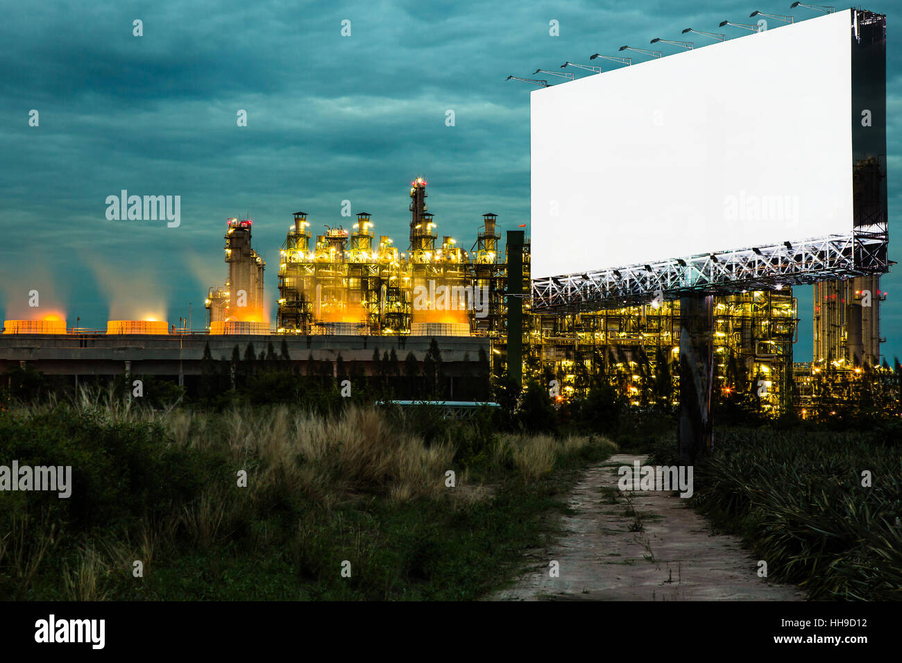 Double exposure of black billboard and electric generating factory at ...