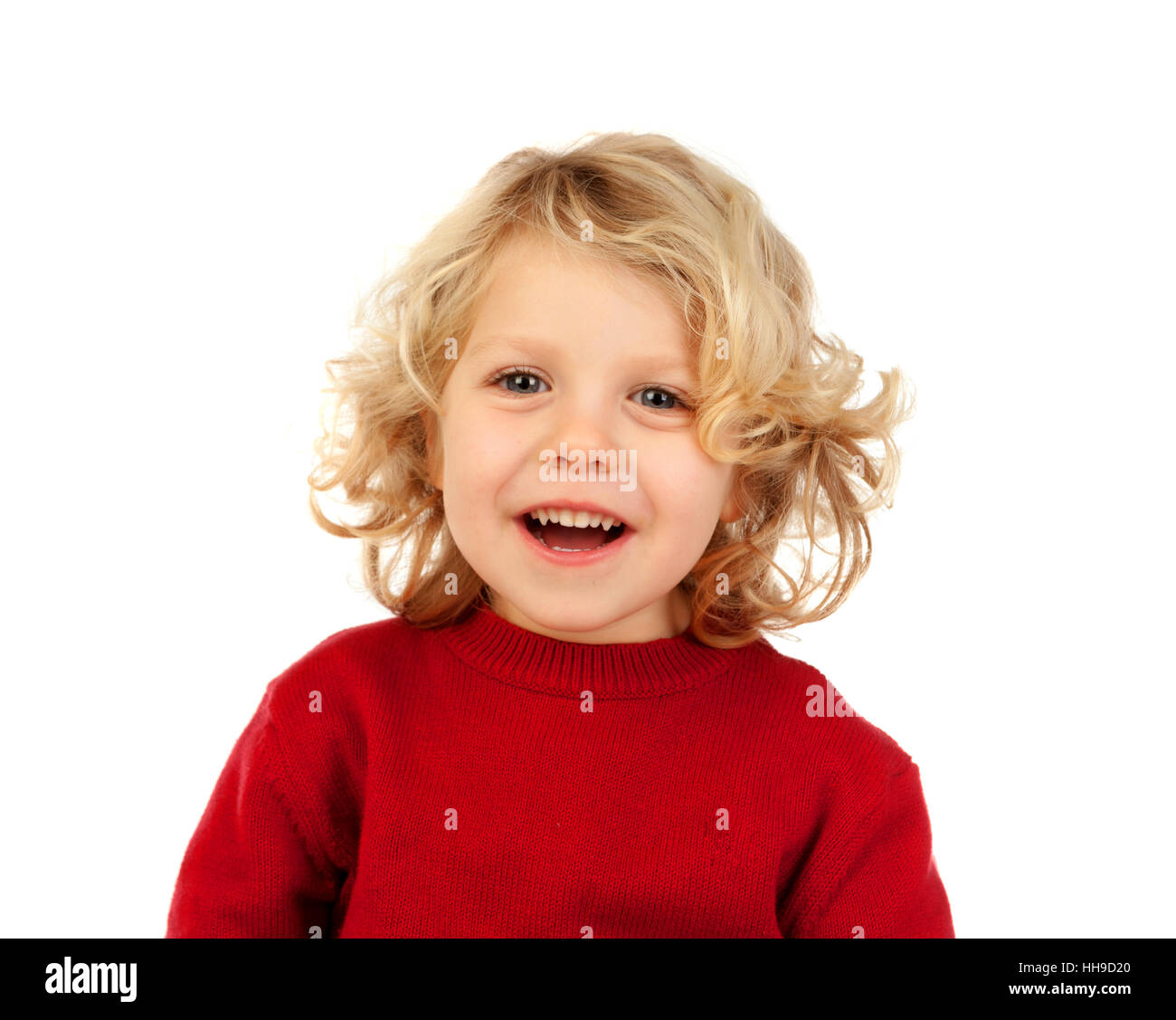 Portrait of playful small kid with long blond hair looking at camera ...