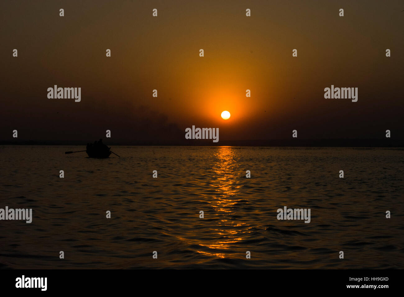 sunset on water side Stock Photo - Alamy