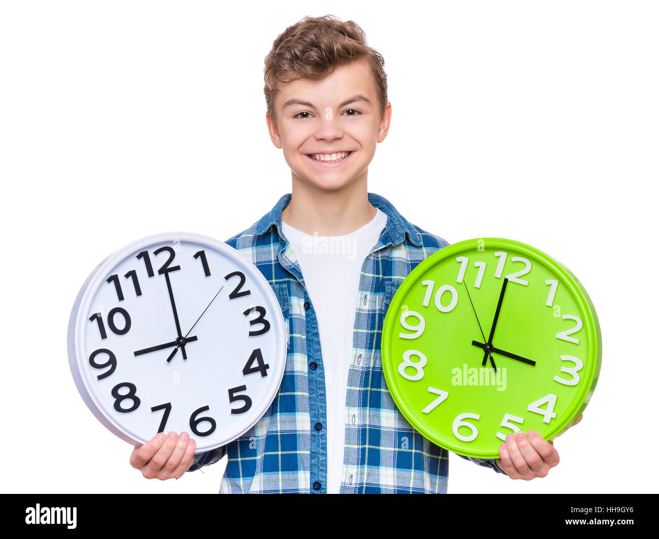 Teen boy with big clock Stock Photo - Alamy