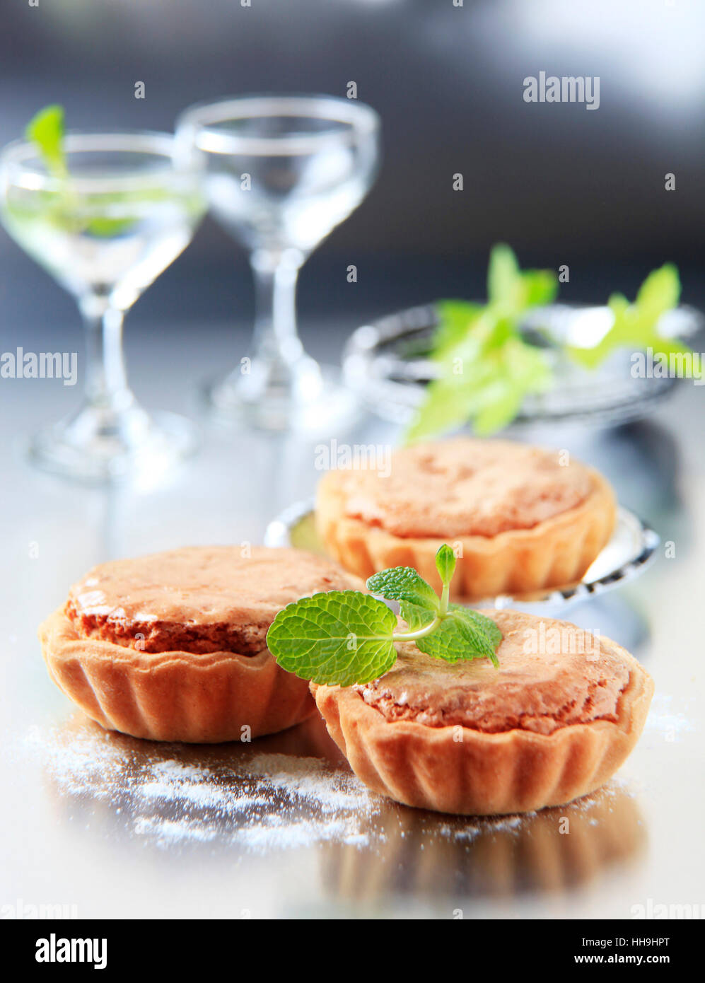 Sweet tartlets with nut and marzipan filling Stock Photo - Alamy
