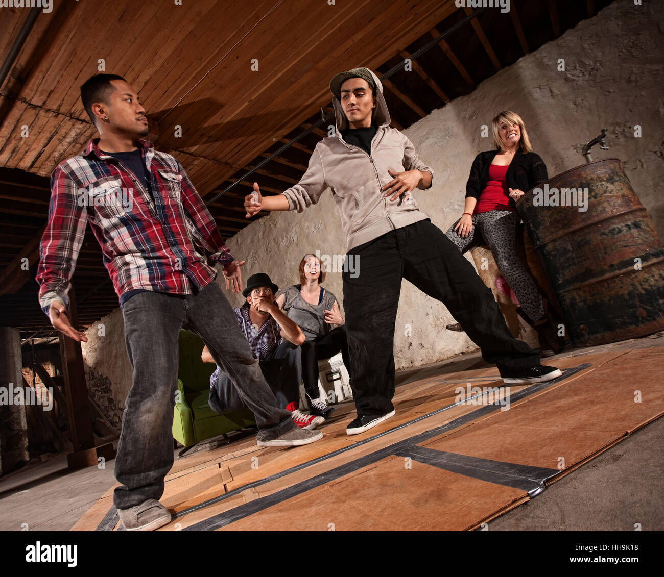 Two handsome Latino men face off in break dancing battle Stock Photo ...