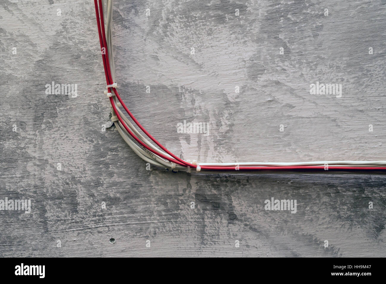 Close-up of electric wires installed on grunge wall Stock Photo - Alamy