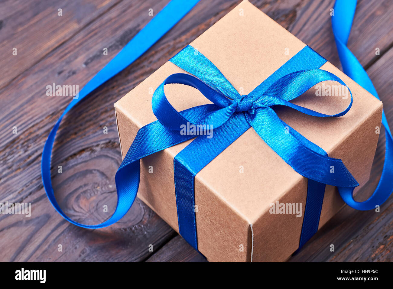 Gift box with blue ribbon Stock Photo - Alamy