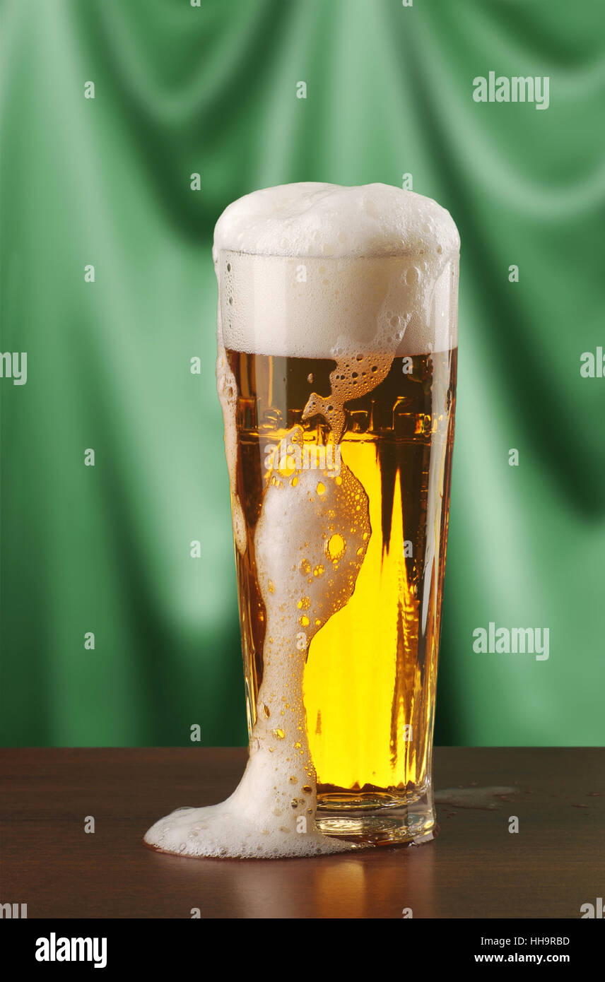 Freshly Poured Beer with Overflowing Foam Stock Photo - Alamy