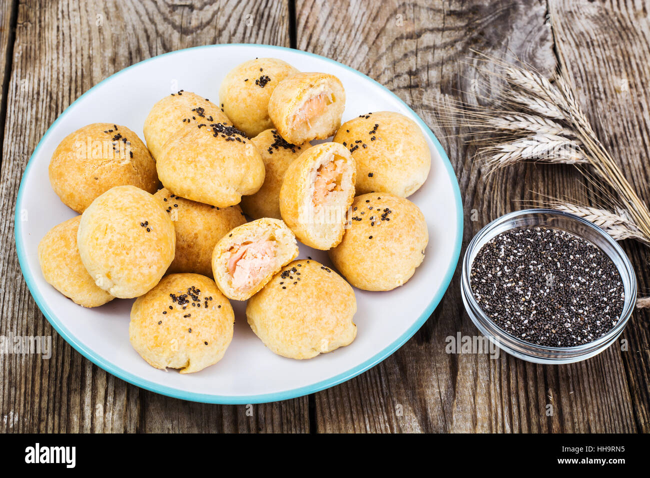 Small cakes with fish and chia seeds Stock Photo - Alamy